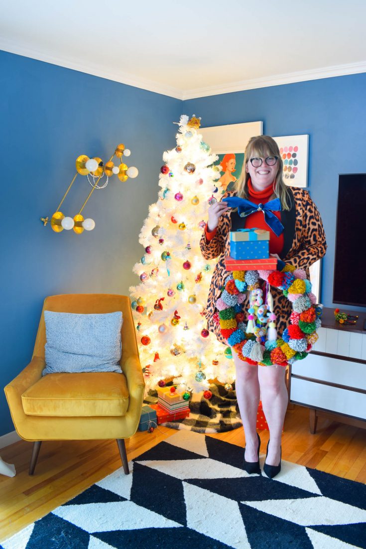 People Posing Next To Christmas Trees • PMQ for two